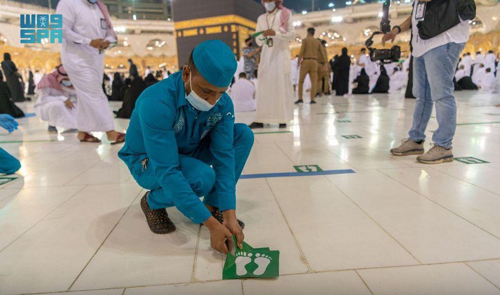 Removing Social Distancing Stickers from All Over Grand Mosque